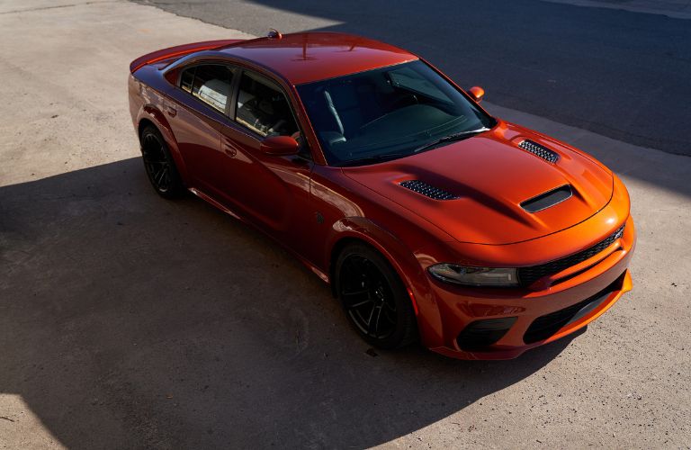 What does the HEMI® Orange Package add to Challenger and Charger?